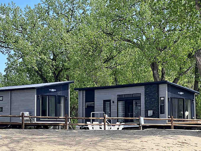 Lakeside cabins offering that perfect blend of "roughing it" and "actually getting a good night's sleep" for modern adventurers.