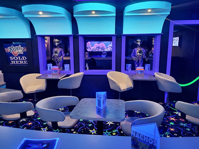 The space cantina offers weary golfers a place to rest between holes, with comfortable seating and cosmic refreshments under starry skies.