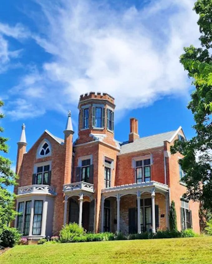 Sunlight plays across The Castle's distinctive tower and arched windows. Architects today would charge extra for these "custom features" that came standard in 1855.