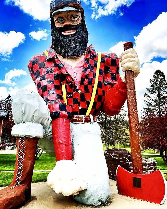 Against a perfect blue sky, Paul's vibrant colors and imposing axe create a quintessential American roadside photo opportunity.