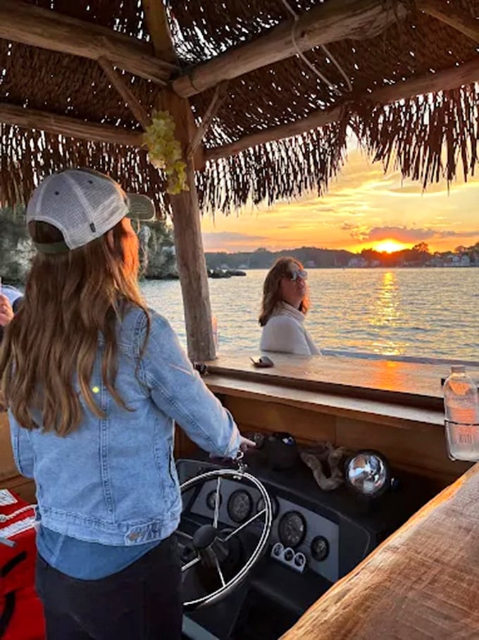 Captain at the helm! Navigating through gentle waves while guests enjoy the unique perspective of seeing Put-in-Bay from the water.