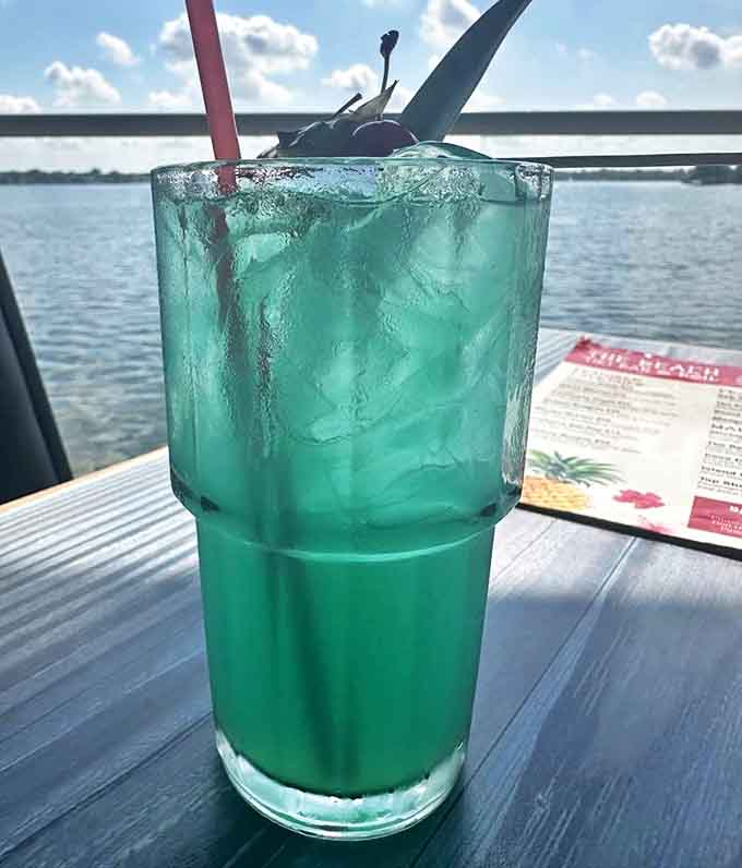 That electric blue cocktail isn't just Instagram bait &ndash; it's a passport to vacation mode, best enjoyed while watching boats drift across Walled Lake.