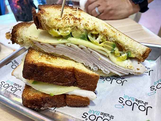 This turkey sandwich isn't just lunch &ndash; it's architectural engineering between two perfectly toasted slices of bread.