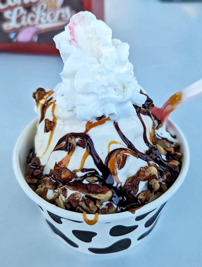 Pecans, caramel, and hot fudge perform a harmonious trio atop vanilla ice cream in this classic turtle sundae.