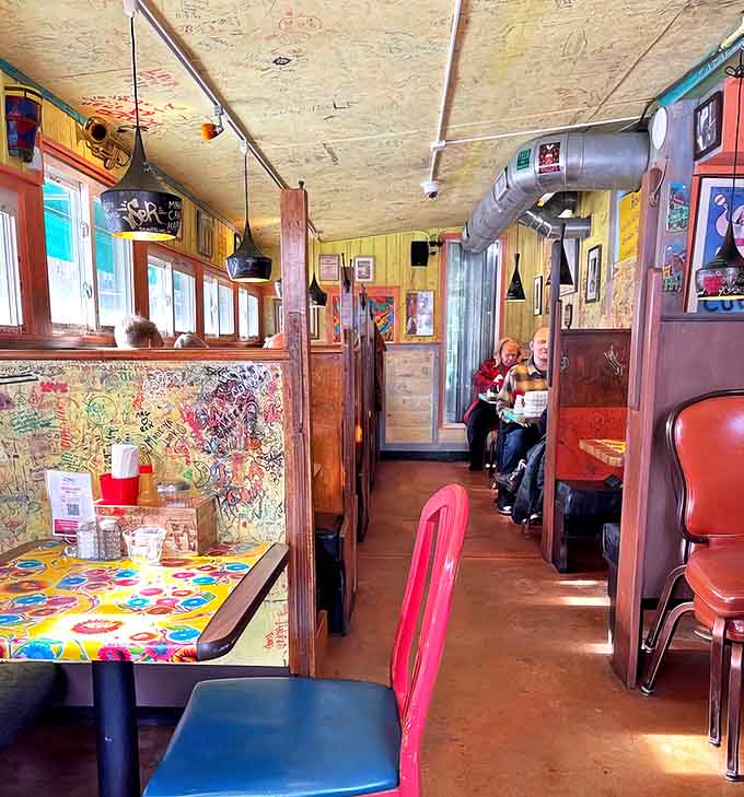 The narrow dining room buzzes with energy and conversation, creating an intimate atmosphere where strangers become friends.
