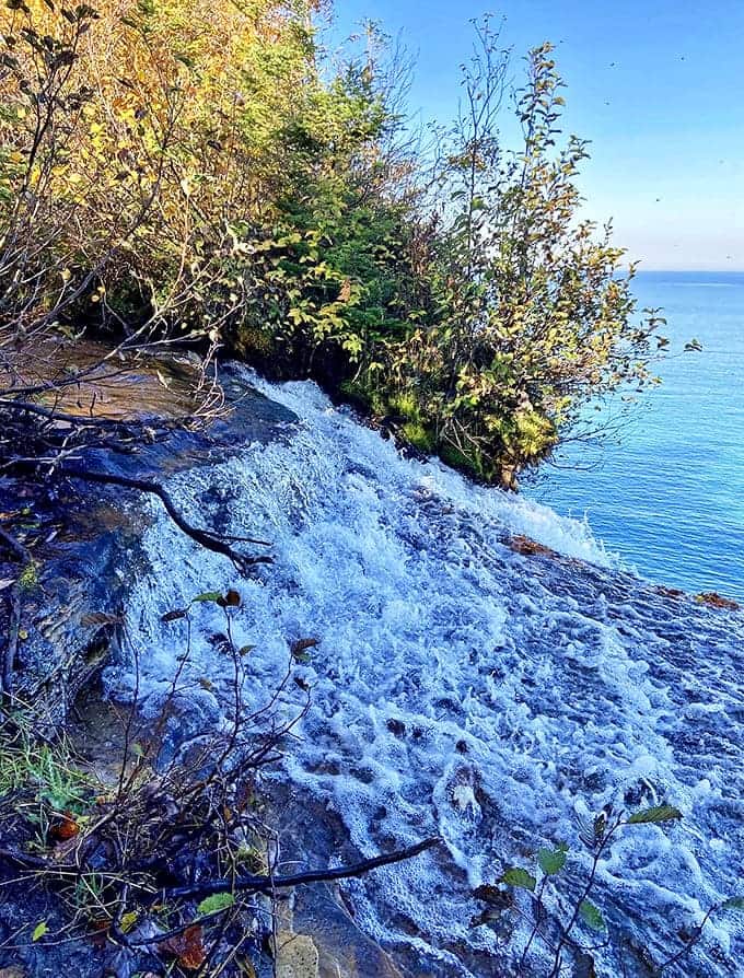 Water dances over ancient rock layers before taking its dramatic plunge, creating a constant symphony that echoes across Lake Superior's surface.