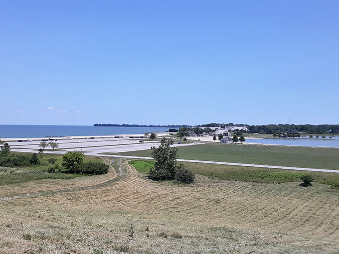 Wide View: The landscape unfolds in layers of texture &ndash; beach, water, and sky creating a natural triptych of Midwestern coastal beauty.
