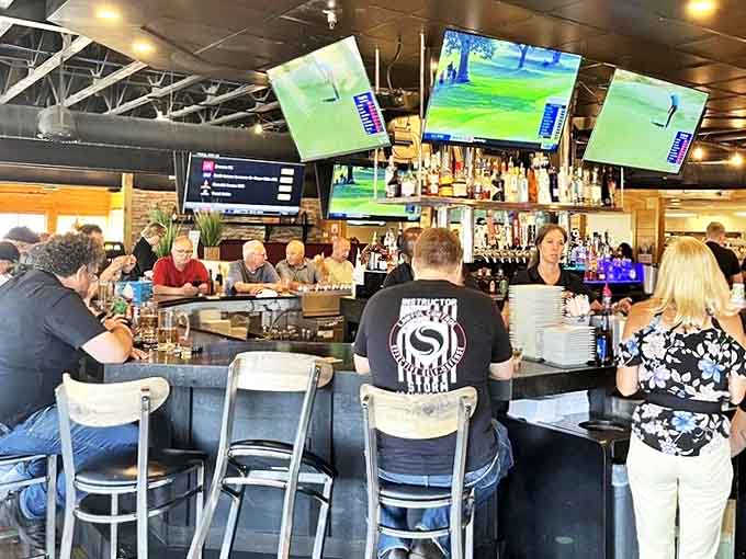 The bar area buzzes with energy as patrons gather to catch the game, share stories, and enjoy Ray J's hospitality.
