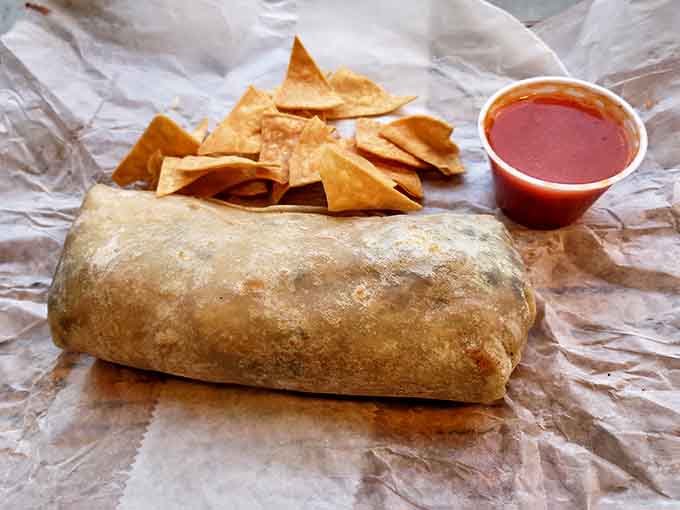 The humble burrito, elevated to art form, rests beside house-made chips that audibly snap with each bite – no sad, stale triangles here!