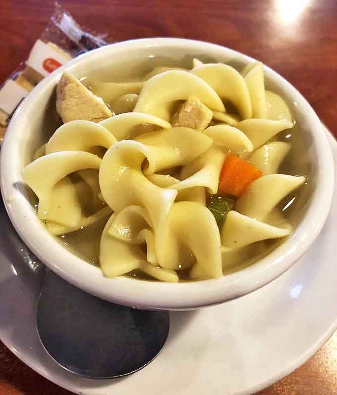 Chicken noodle soup that tastes like someone's grandmother has been simmering it all day, even if you order at 11 AM.