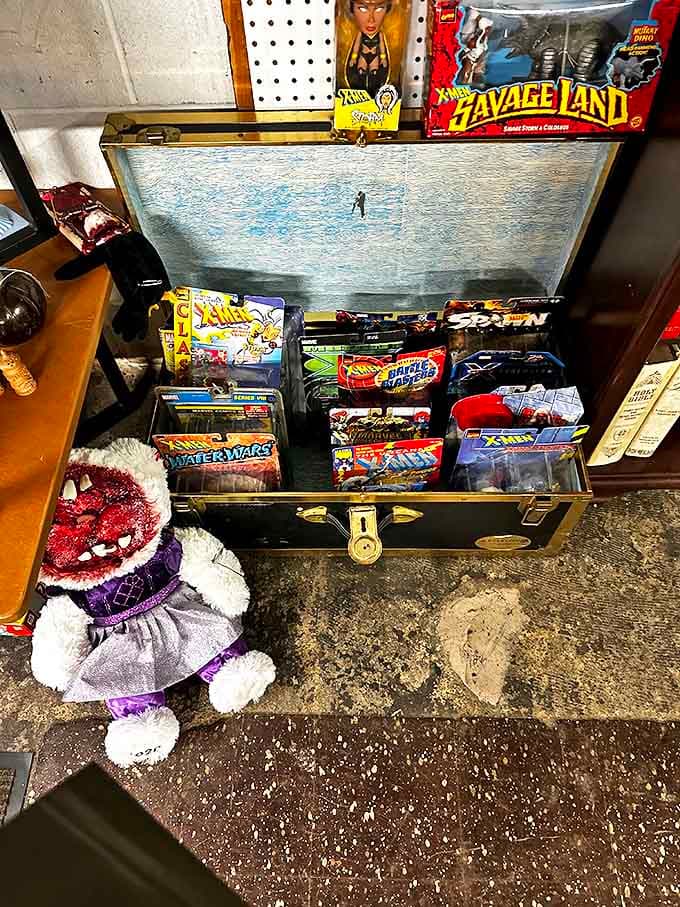 Vintage action figures and comics nestle in their display case like a time capsule of childhood nightmares and adult collectible obsessions.