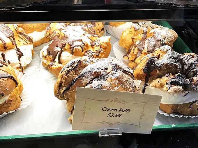 Cream puffs that defy gravity &ndash; light, airy shells hiding creamy centers that make you close your eyes with each heavenly bite.