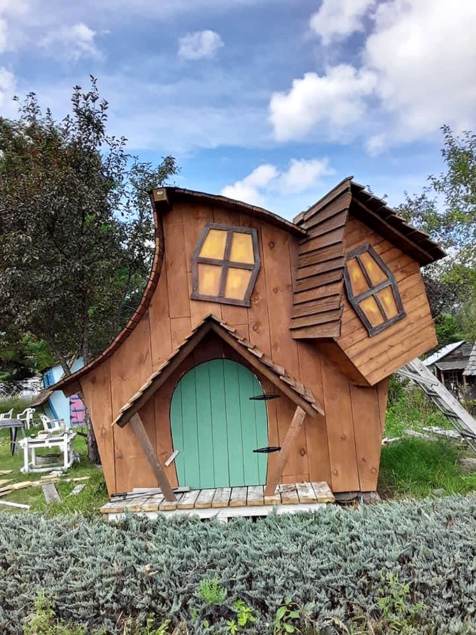 This crescent-roofed wonder defies architectural norms with its curved walls and whimsical windows that catch the light.