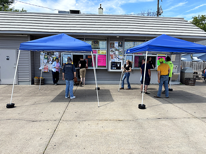 The line at Belt's becomes a community gathering spot where strangers bond over a shared mission: conquering Wisconsin's tallest ice cream.