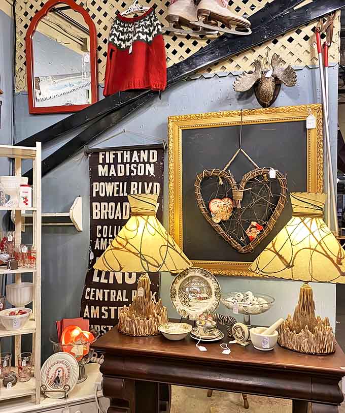 A charming vignette featuring street signs and decorative elements creates a moment of nostalgic urban elegance against a soft blue wall.