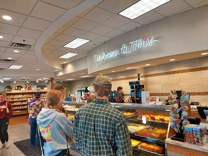 The bakery counter buzzing with activity &ndash; where pastry dreams come true and diet plans are cheerfully postponed until tomorrow.