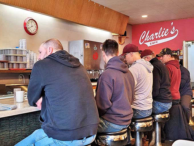 The bar area buzzes with energy as patrons gather between games, sharing stories and strategies over craft drinks.