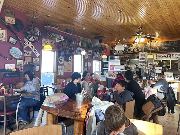 A gathering of breakfast enthusiasts enjoying their meals at wooden tables&mdash;the modern-day equivalent of breaking bread with your tribe.