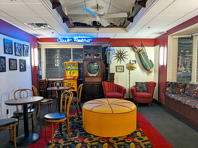 The dining area balances nostalgia with comfort, where vintage photographs watch over patrons enjoying timeless American classics.