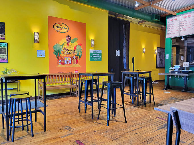 The dining area's cheerful minimalism lets the food take center stage, while corrugated metal ceilings add that authentic island architectural touch.