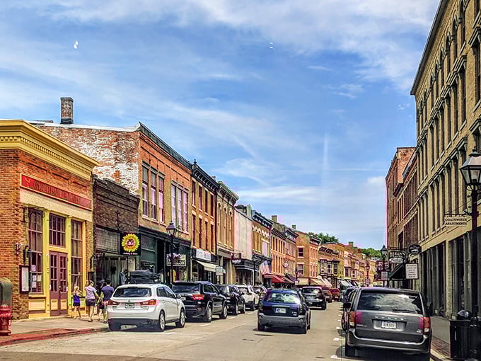 Shoppers stroll past storefronts that have witnessed generations of commerce, from lead mining supplies to artisanal chocolates.