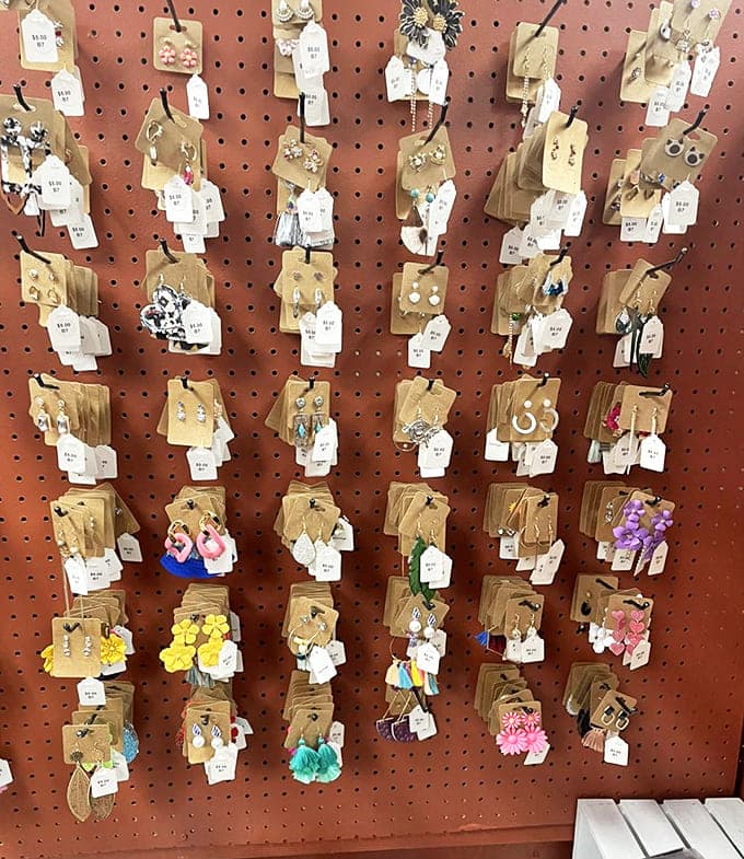 Colorful earrings dangle from display cards like a rainbow of possibilities, offering affordable accessories that add personality to any outfit choice.