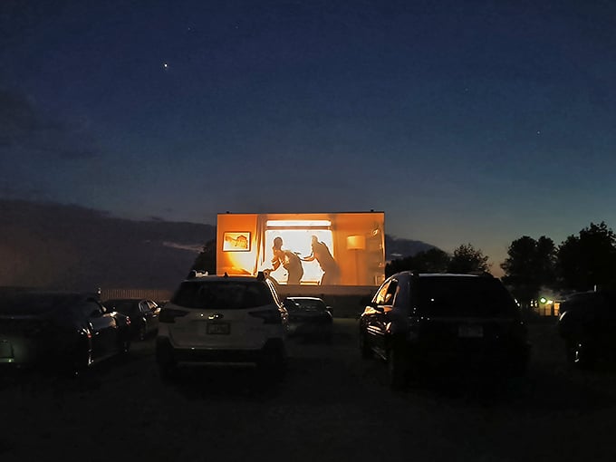 Silhouettes dance across the screen as dusk gives way to night, the perfect transition into movie magic.