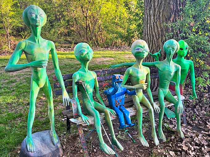 "The earthlings seem friendly enough," whisper these green visitors as they enjoy Minnesota hospitality with their robot companion.