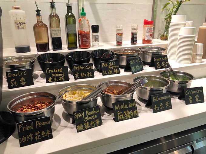 Become your own flavor scientist at the DIY sauce bar, where garlic, chili oil, and sesame create infinite possibilities for dipping perfection.