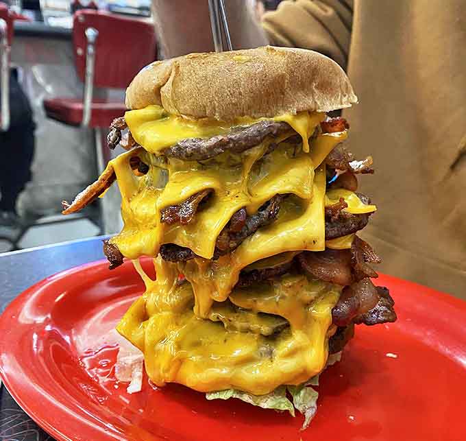 This skyscraper of beef doesn't just challenge your jaw&mdash;it questions your life choices while simultaneously confirming you've made the right one.