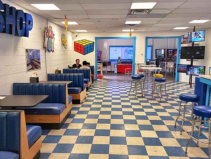 Blue booths invite sweet conspiracies while a Rubik's Cube watches from the wall &ndash; this isn't just eating, it's time travel with taste buds.