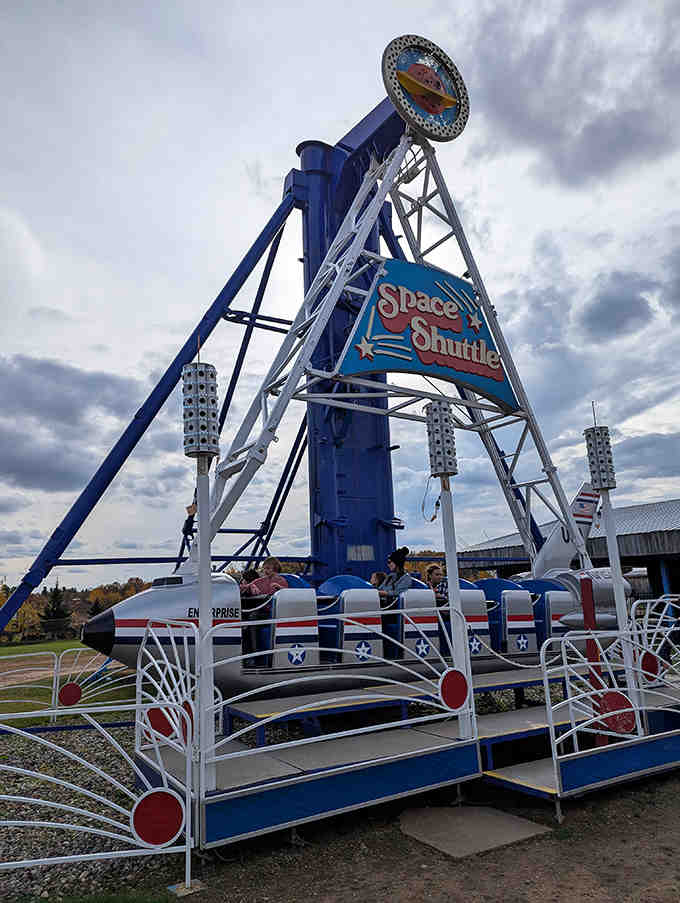 The Space Shuttle ride delivers just enough thrill without terrifying younger riders &ndash; note the strategic grip on the safety bar!