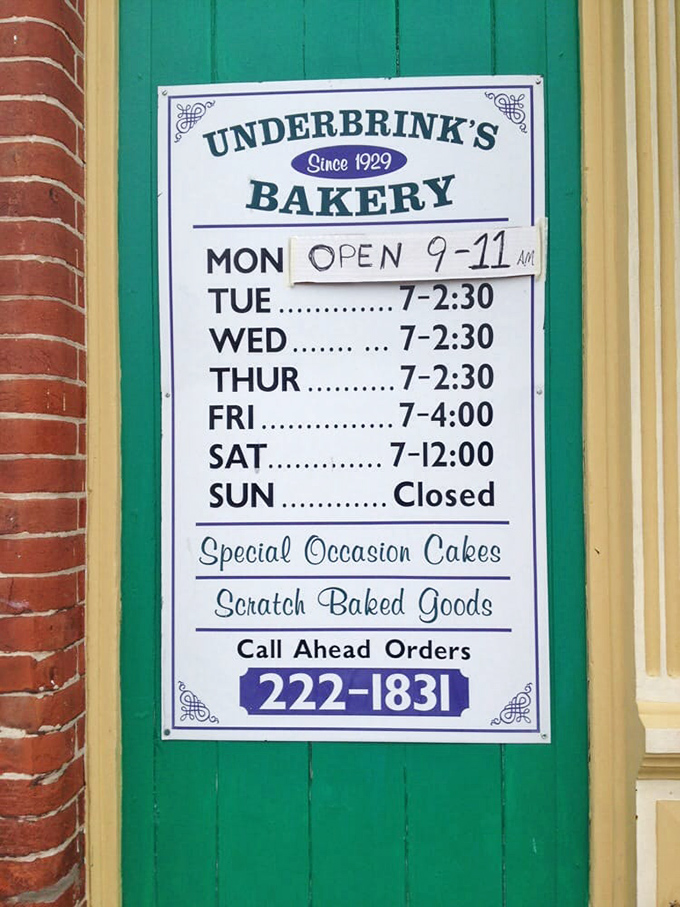 Operating hours posted with small-town charm. The handwritten Monday adjustment speaks volumes about their authentic, human touch.
