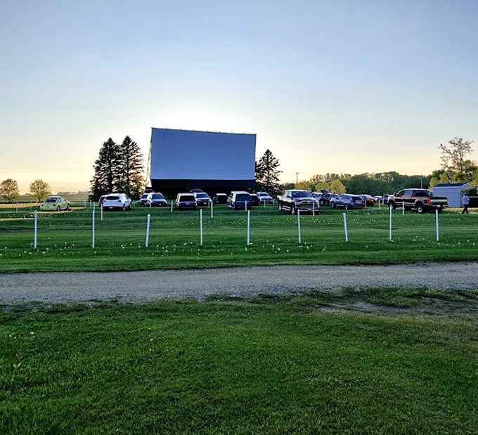 From a distance, the screen rises from the landscape like a monument to American leisure, promising entertainment under open skies.
