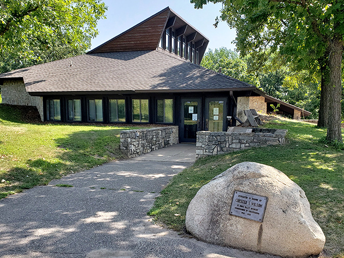 The visitor center blends seamlessly into its surroundings, its rustic stone and timber design echoing the natural beauty it celebrates.