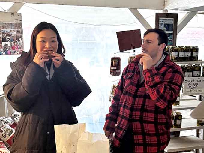 The universal expression of donut bliss &ndash; visitors experiencing that first magical bite of freshly made perfection.