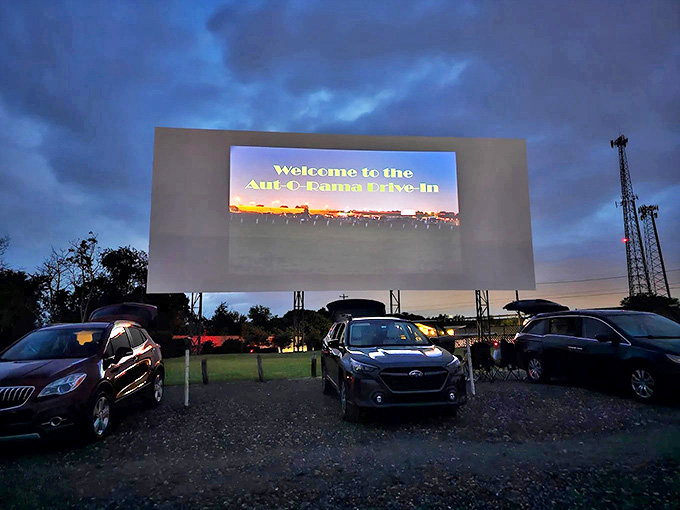 Welcome to the Aut-O-Rama Drive-In glows against the darkening sky, signaling the start of an evening of big-screen magic.