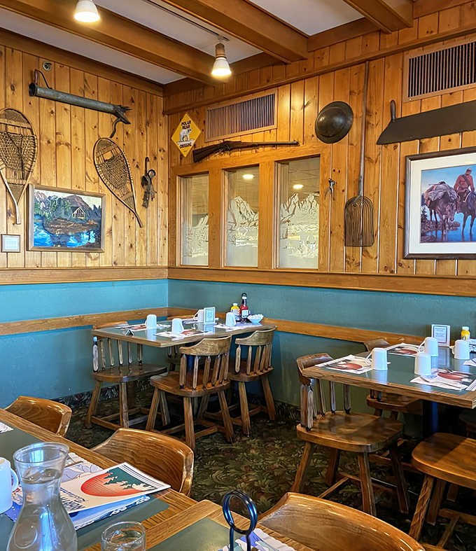 Every corner tells a story in this northwoods-themed dining room where snowshoes and fishing nets transform a meal into an experience.