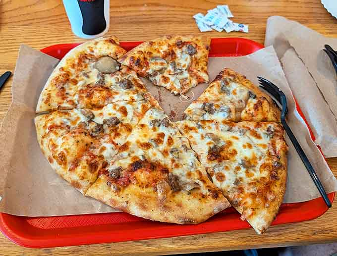 Even the pizza gets the barbecue treatment, with a golden cheese blanket covering savory toppings on a perfect crust.