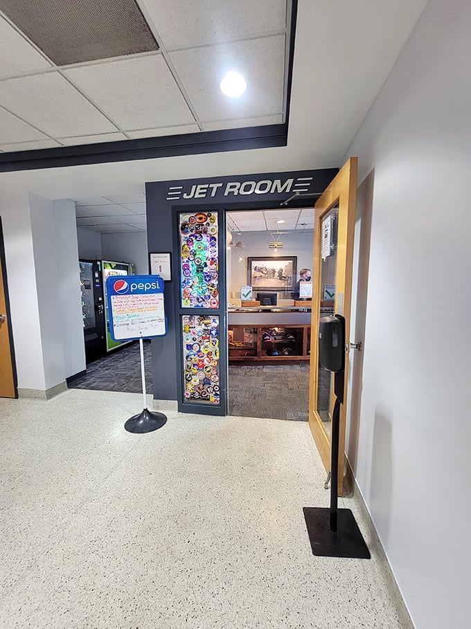 Pilot's paradise! The "Jet Room" entrance leads to a unique dining experience with runway views and aviation memorabilia.