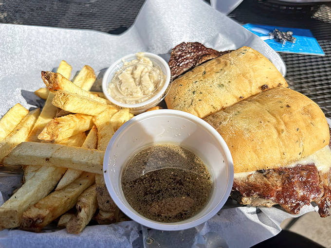 The Prime Rib Sandwich arrives with crusty bread, tender meat, and fries so good you'll guard them from table-reaching companions.