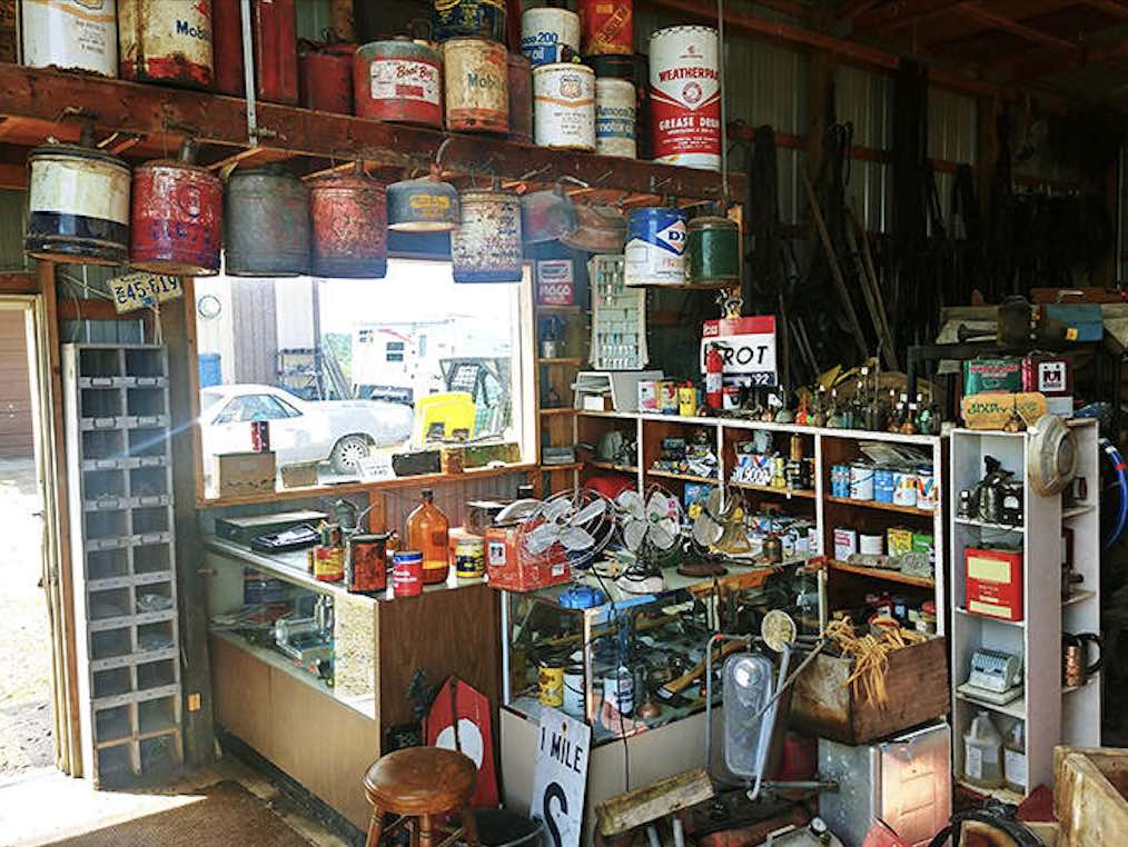 Vintage tins create a colorful timeline of American advertising, each rusty container holding memories of products long vanished from store shelves.