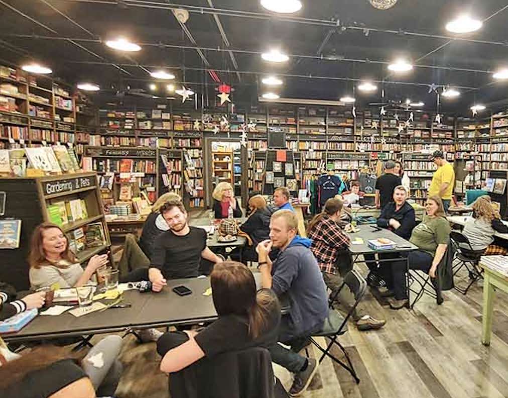 Community happens naturally here, where readers gather around tables to share thoughts on books, proving literature is best when discussed over good coffee.