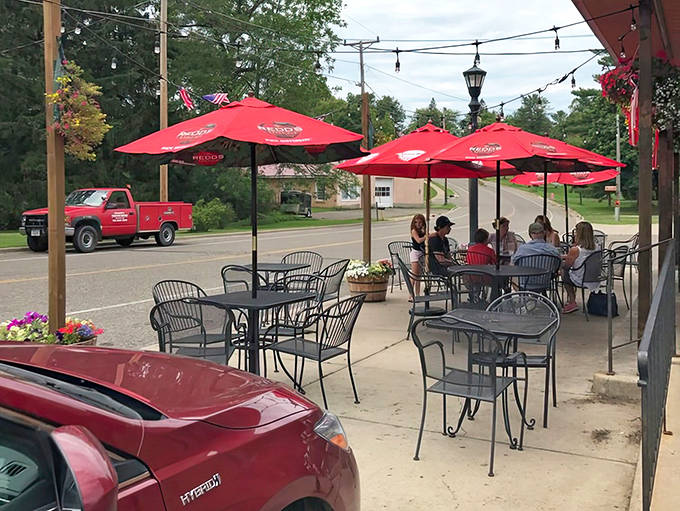 Summer in Minnesota means patio dining under red umbrellas, where every table feels like the best seat in the house.
