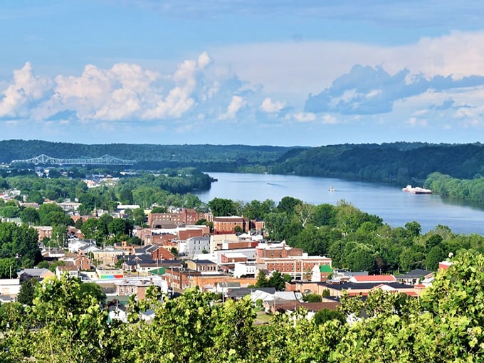 Gallipolis unfolds like a storybook from above, with the mighty Ohio River embracing the town while historic buildings stand proudly against the rolling hills beyond.