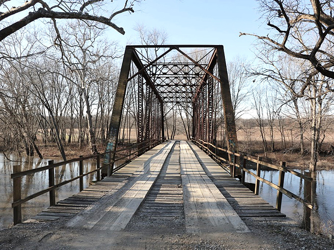 Weathered wooden planks stretch across rusted iron trusses, inviting brave souls to cross the infamous Airtight Bridge.