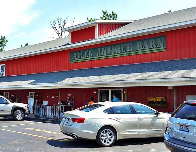 The iconic red exterior of Allen Antique Barn stands proudly as Michigan's temple to treasures past, beckoning collectors and casual browsers alike.