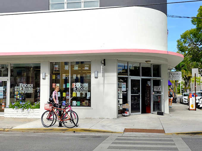 The iconic curved fa&ccedil;ade of Books & Books beckons bibliophiles with its classic signage and inviting storefront, a literary lighthouse in Key West's artistic district.