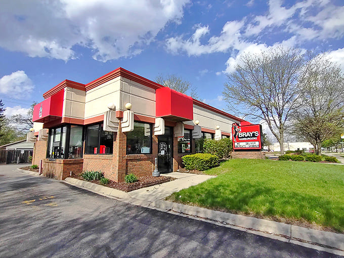 The iconic red-trimmed exterior of Bray's Hamburgers stands like a beacon of burger hope on Ford Road, promising delicious nostalgia inside.