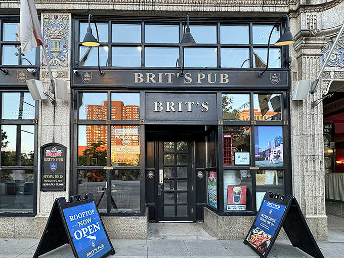 The stately fa&ccedil;ade of Brit's Pub welcomes visitors with British charm, the St. George flag fluttering proudly against the Minneapolis skyline.